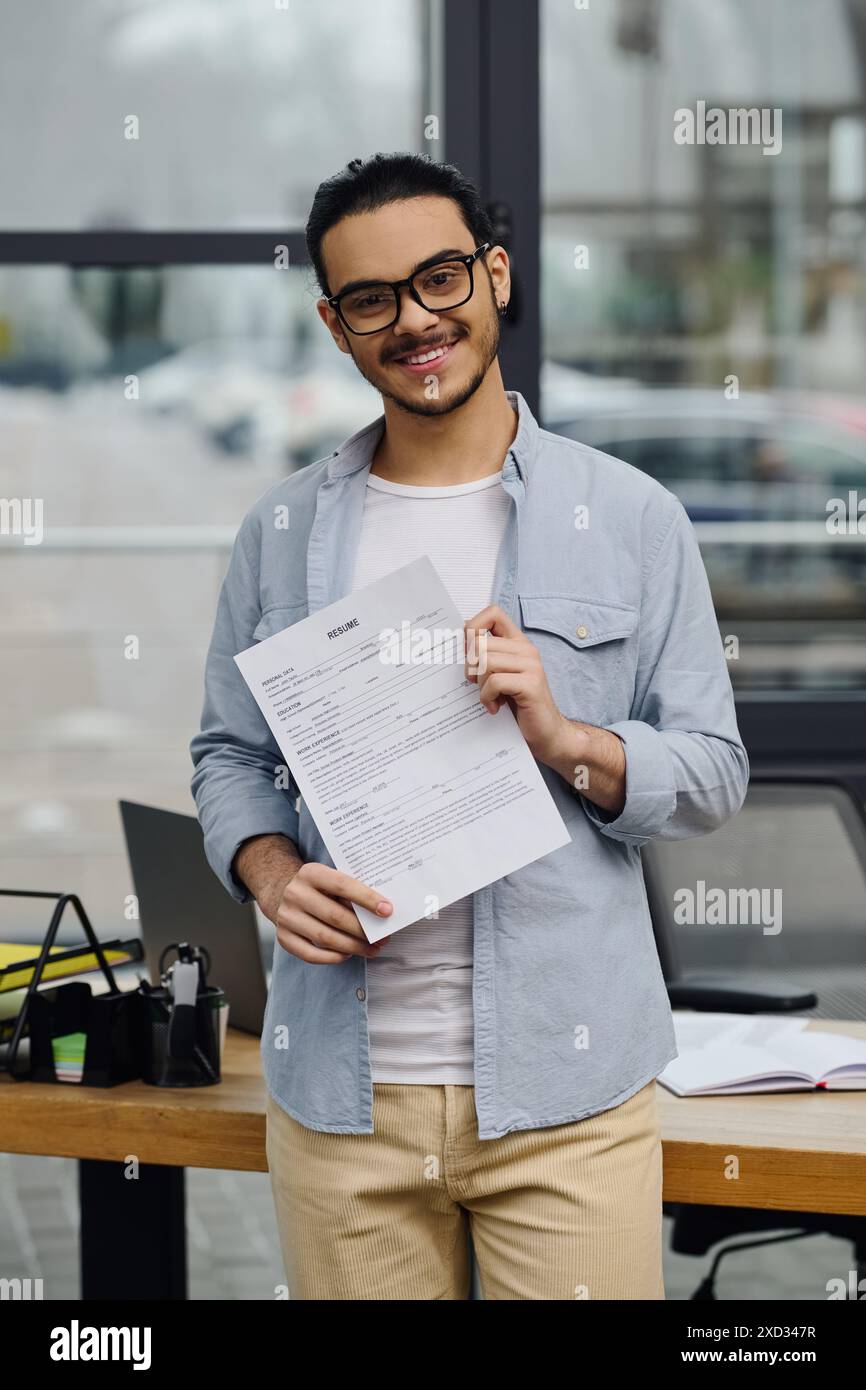 Job seeker showing document during interview Stock Photo - Alamy