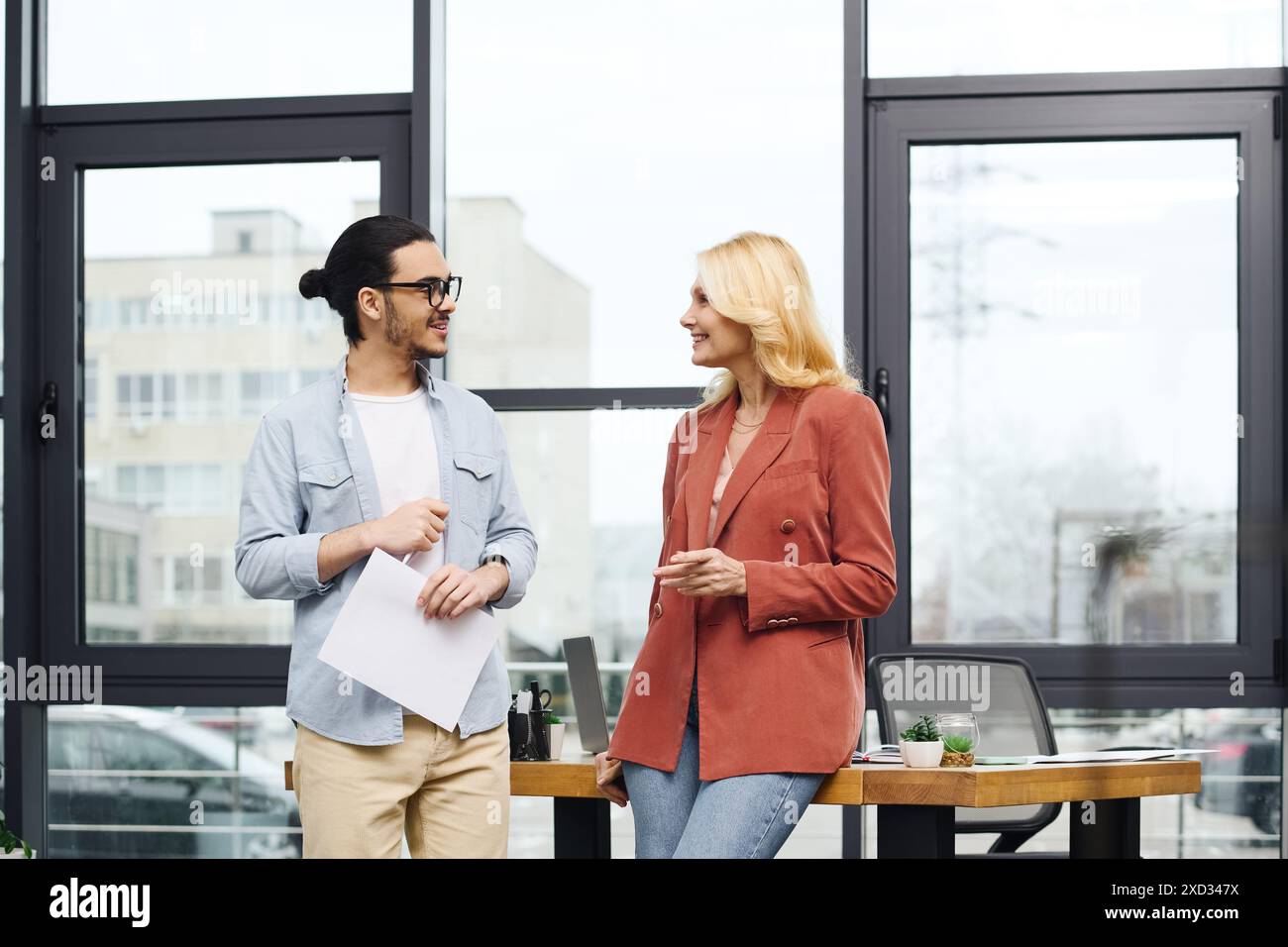 A scene in an office with two individuals engaged in a conversation ...