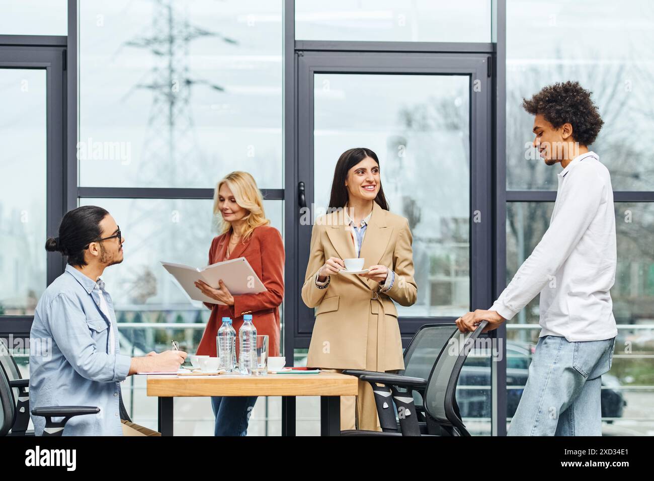 Team sitting around table in hi-res stock photography and images - Alamy