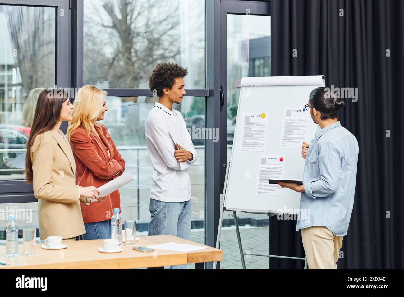Group of job seekers on interview, discussing ideas in front of ...