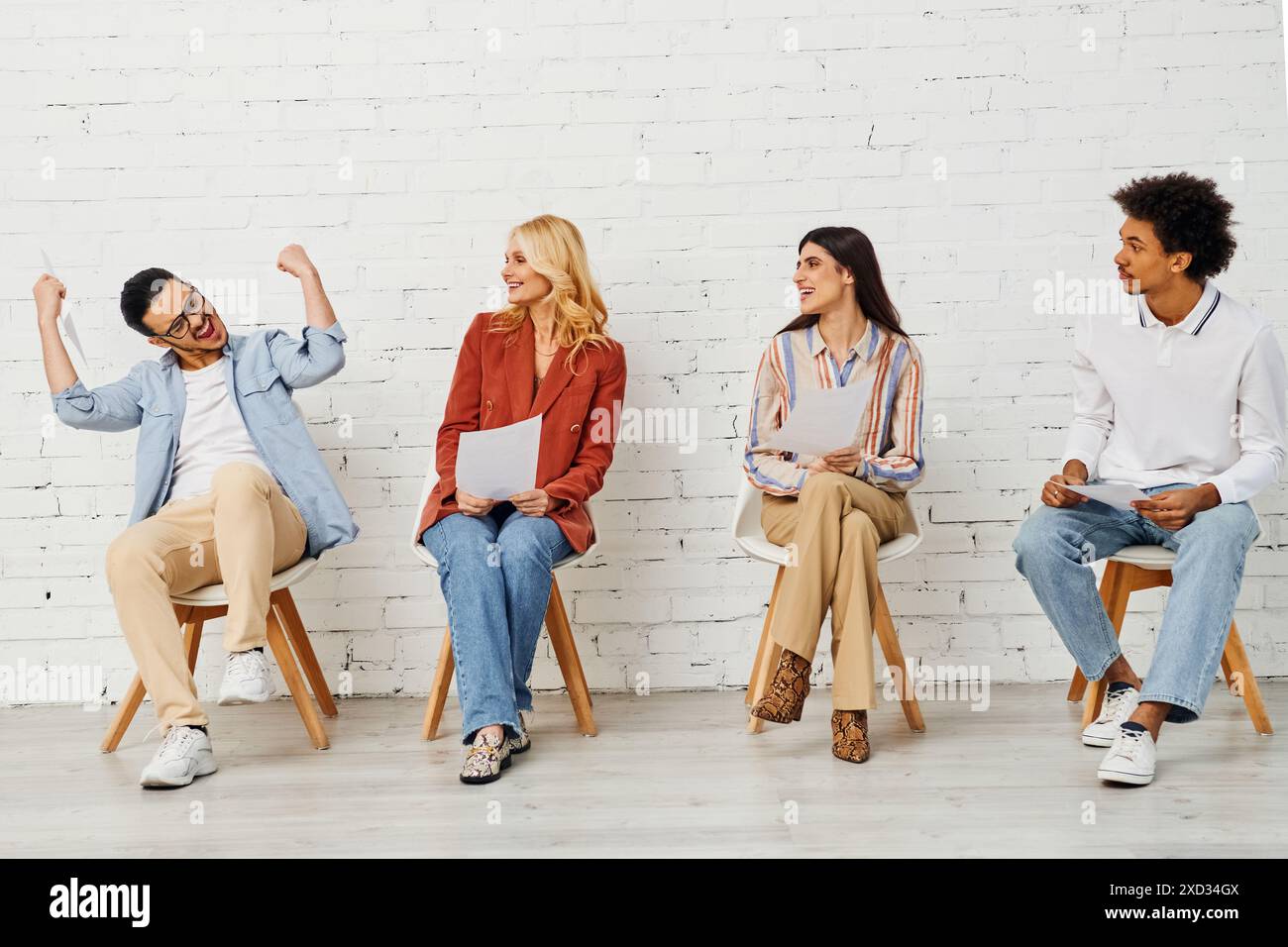 Excited group cheering seated hi-res stock photography and images - Alamy