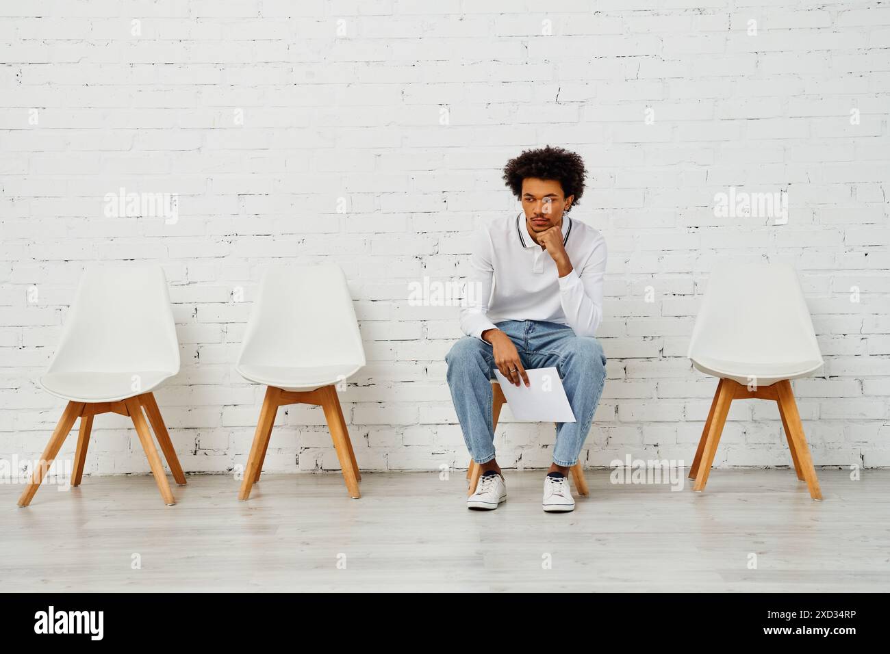 Stylish chair against wall hi-res stock photography and images - Alamy