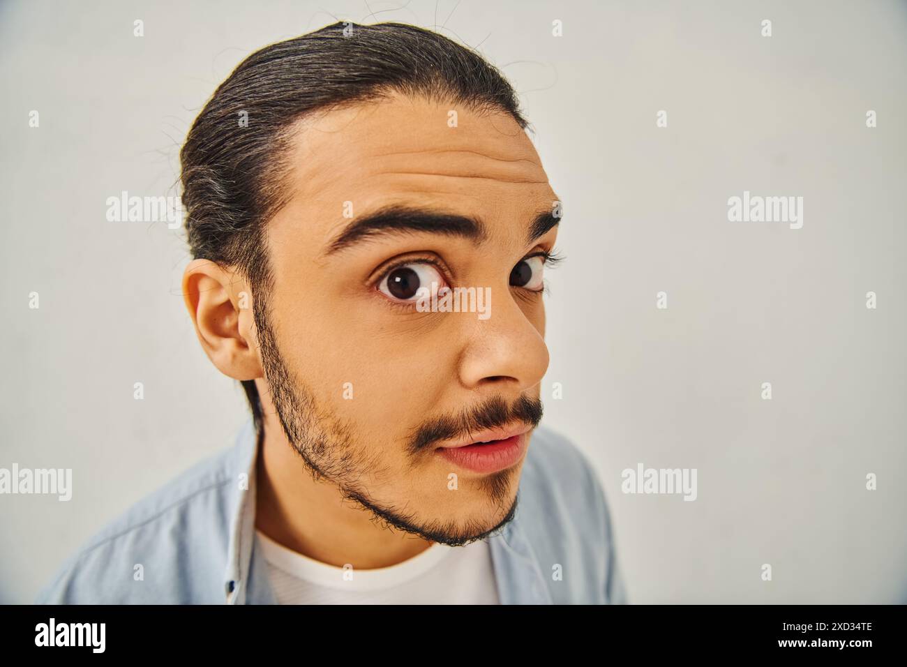 Man with mustache makes funny face Stock Photo - Alamy