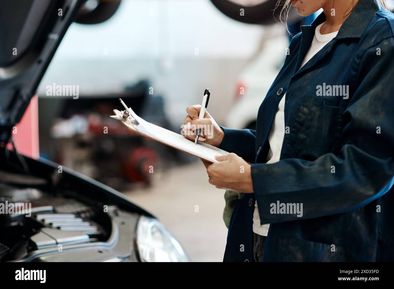 Workshop hands inspection paperwork hi-res stock photography and images ...