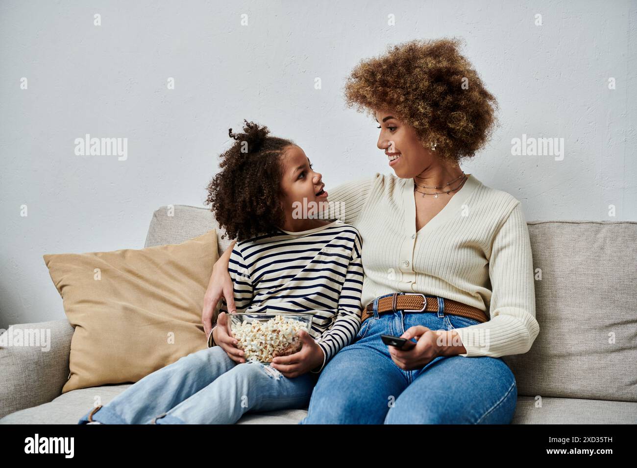 Happy African American mother and daughter sharing a moment on the ...