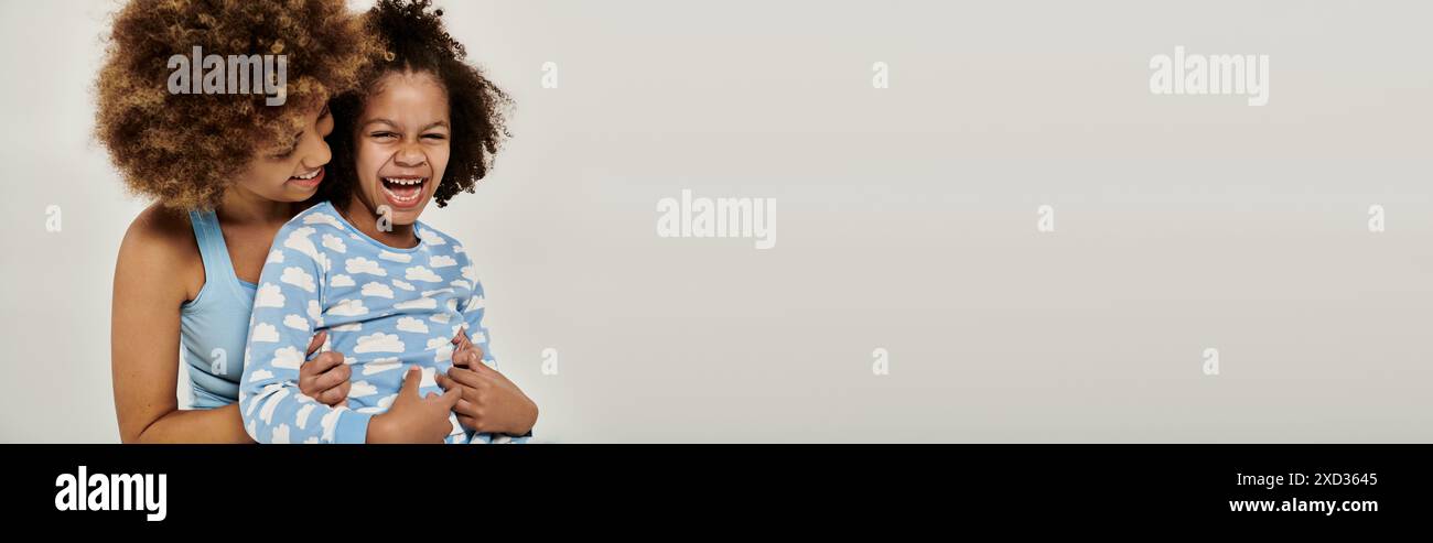 Two children hugging each other hi-res stock photography and images - Alamy