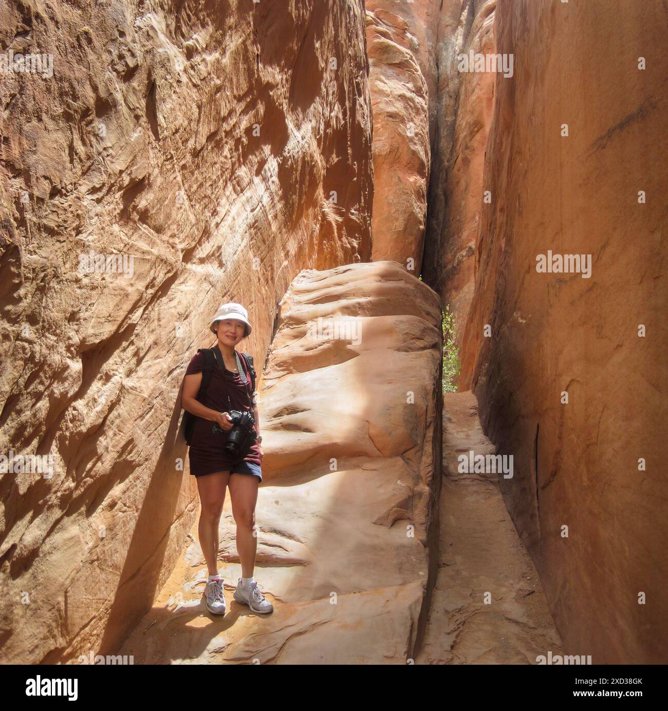 Female tourist posing for photos at Arches National Park. Utah. USA ...