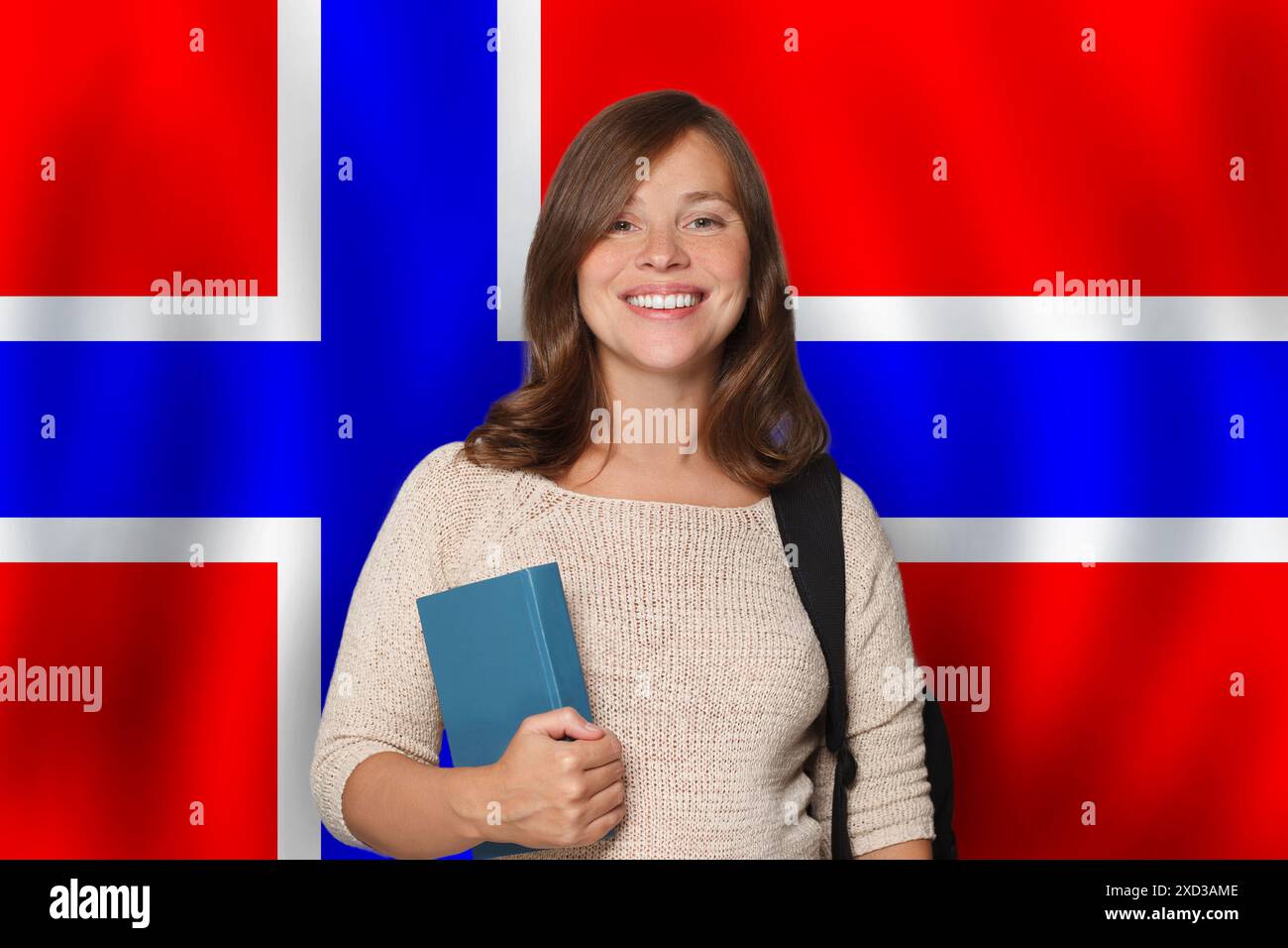 Cute young woman student against Norwegian flag background. Travel ...
