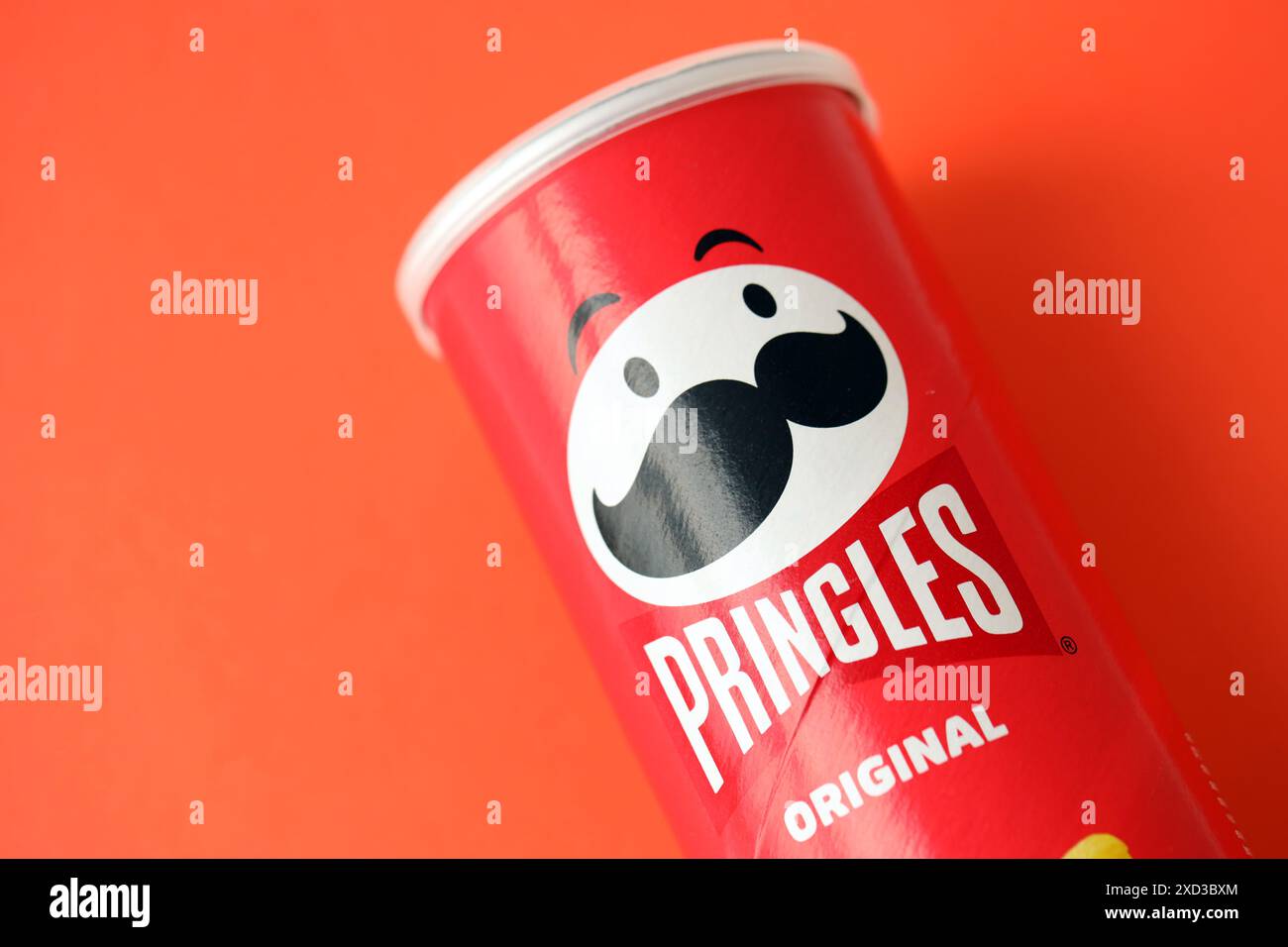 KYIV, UKRAINE - APRIL 20, 2024 Pringles original potato chips on red ...