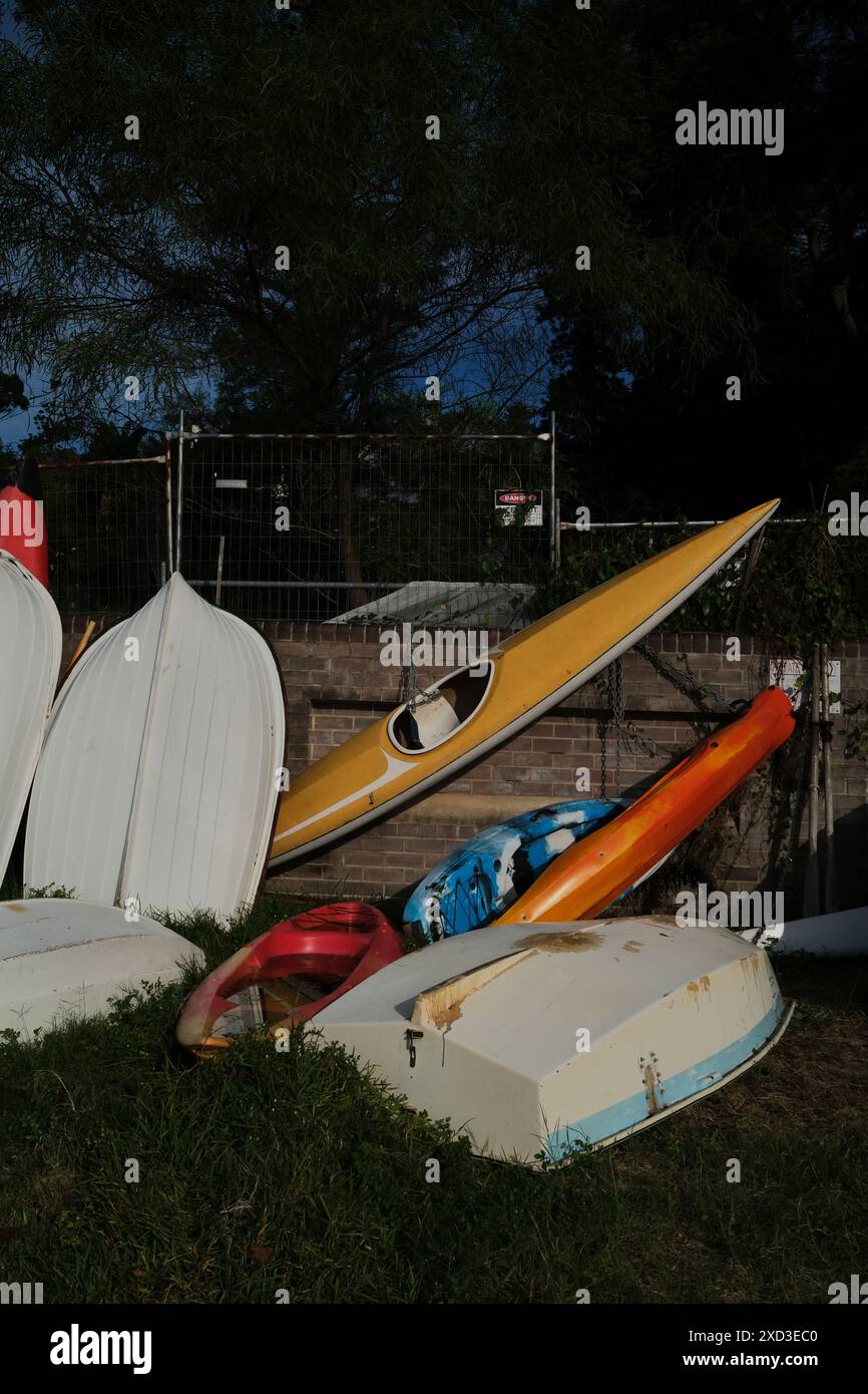 Row boats and kayaks, surfcraft stored on Seven Shillings Beach, in ...