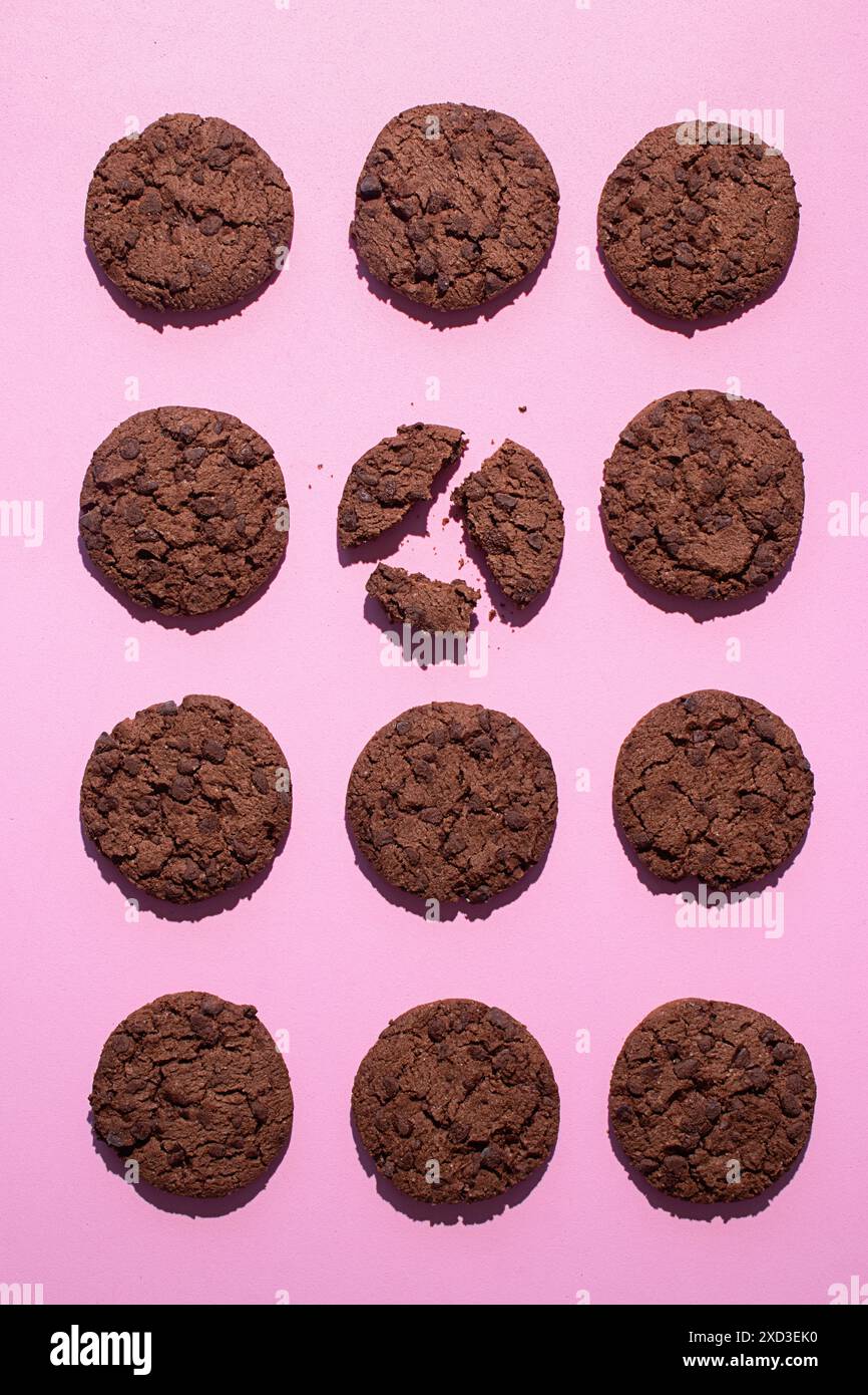 Top view of multiple chocolate chip cookies symmetrically placed on a ...