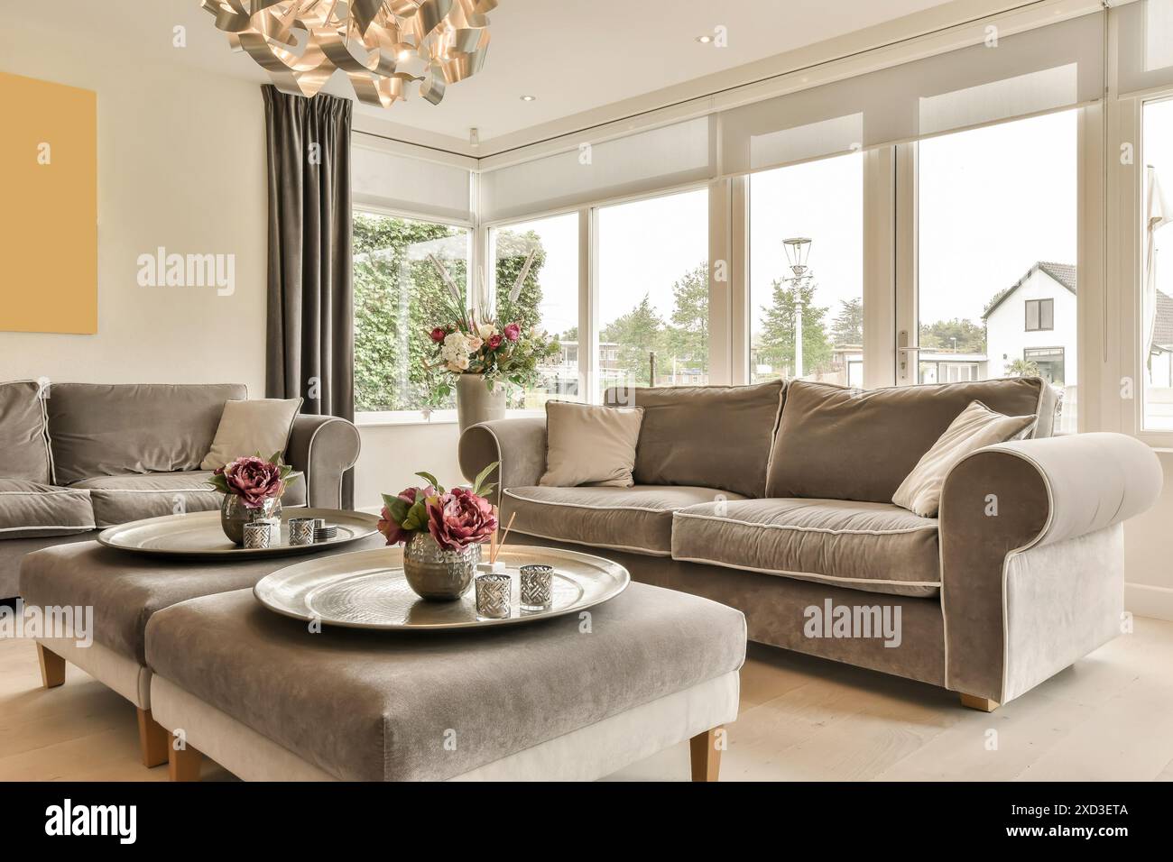 A living room with two sofas and a coffee table in front of the couch ...