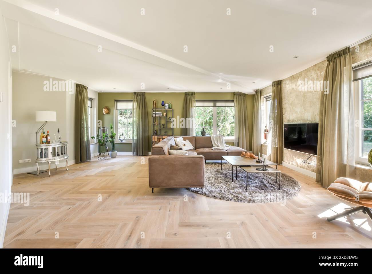 A beautifully appointed, spacious living room featuring a modern ...