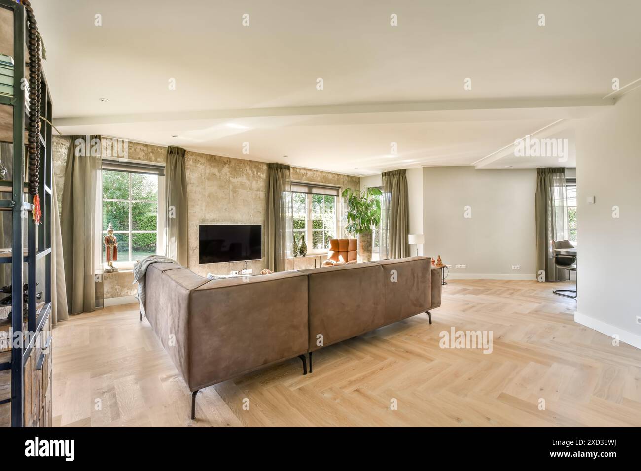Elegant interior of a luxurious living room featuring a suede sofa ...