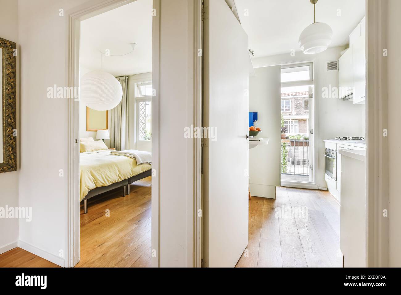 An inviting view into a bright and modern bedroom through an open ...