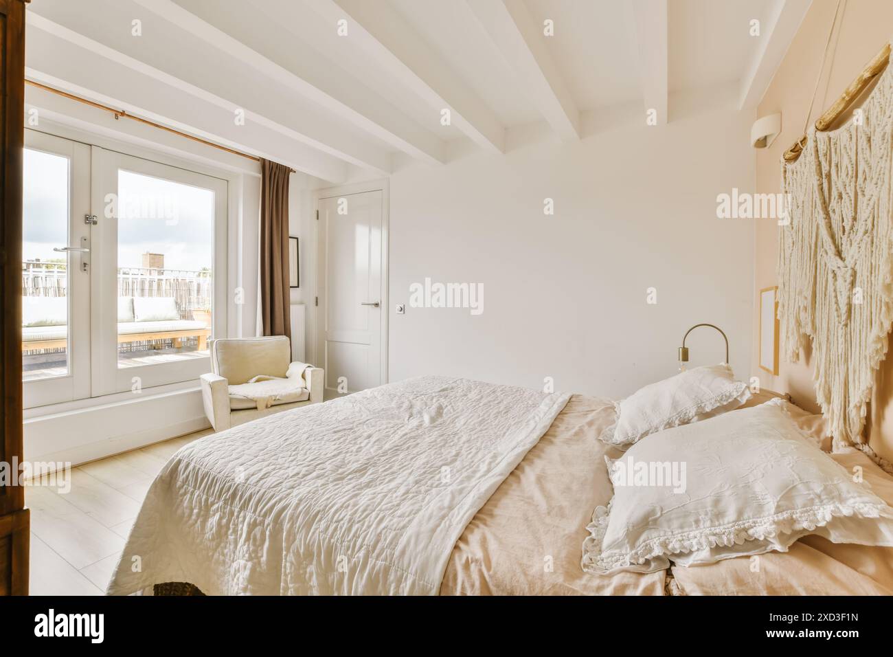 A cozy room capturing the essence of comfort with white walls and ...