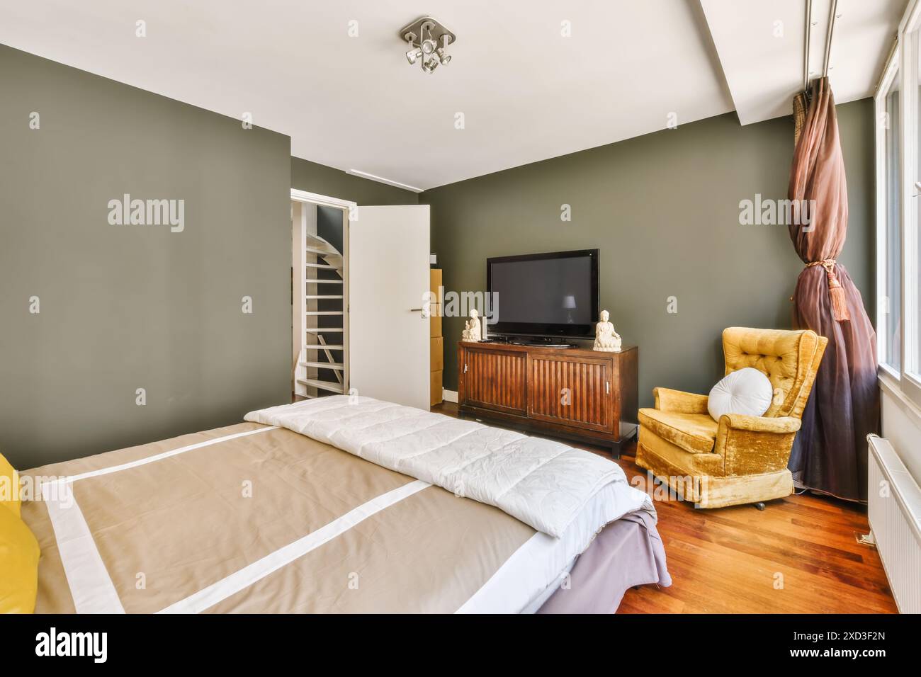 A tastefully decorated modern bedroom featuring a blend of contemporary ...