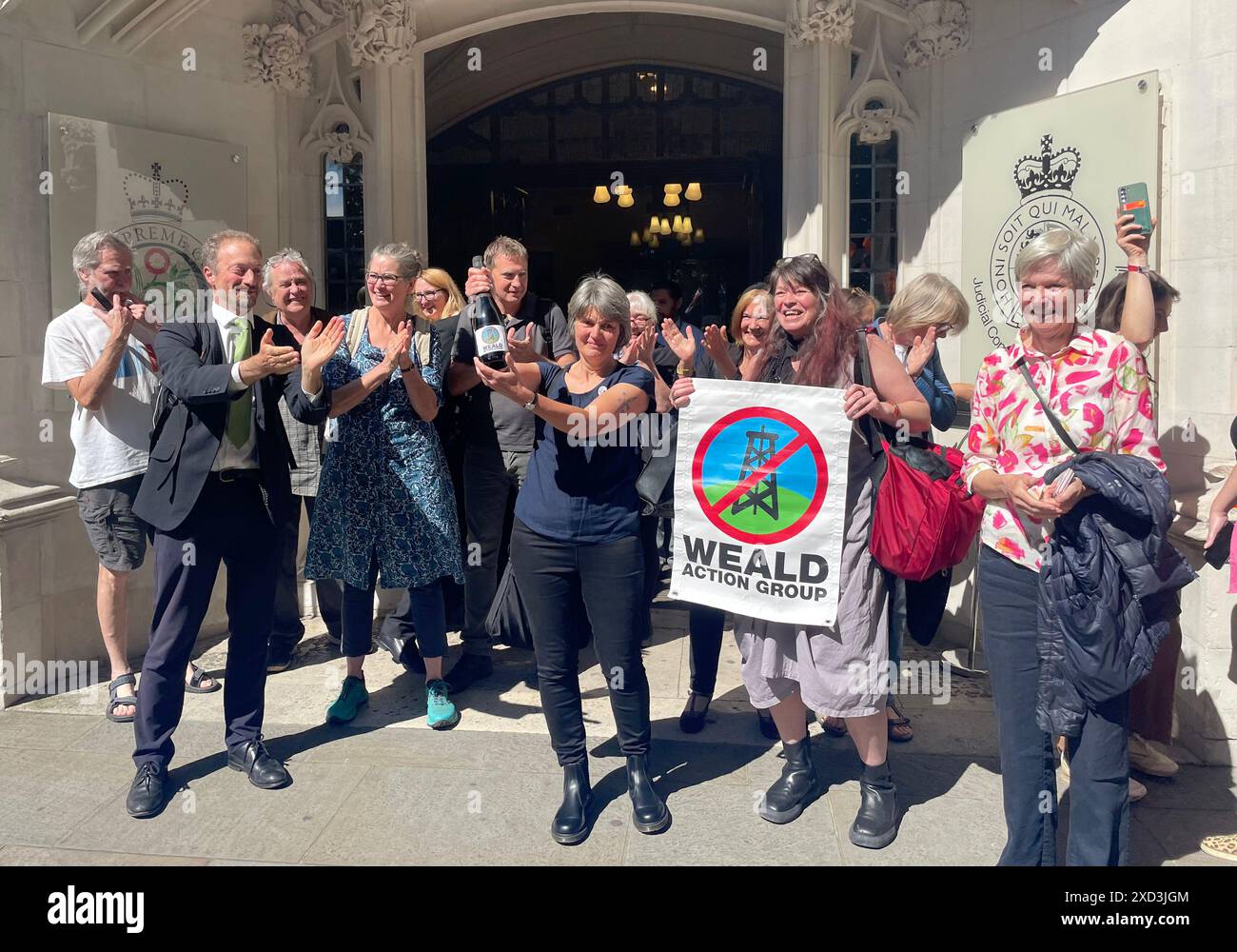 Environmental campaigner Sarah Finch (centre) outside the Supreme Court ...