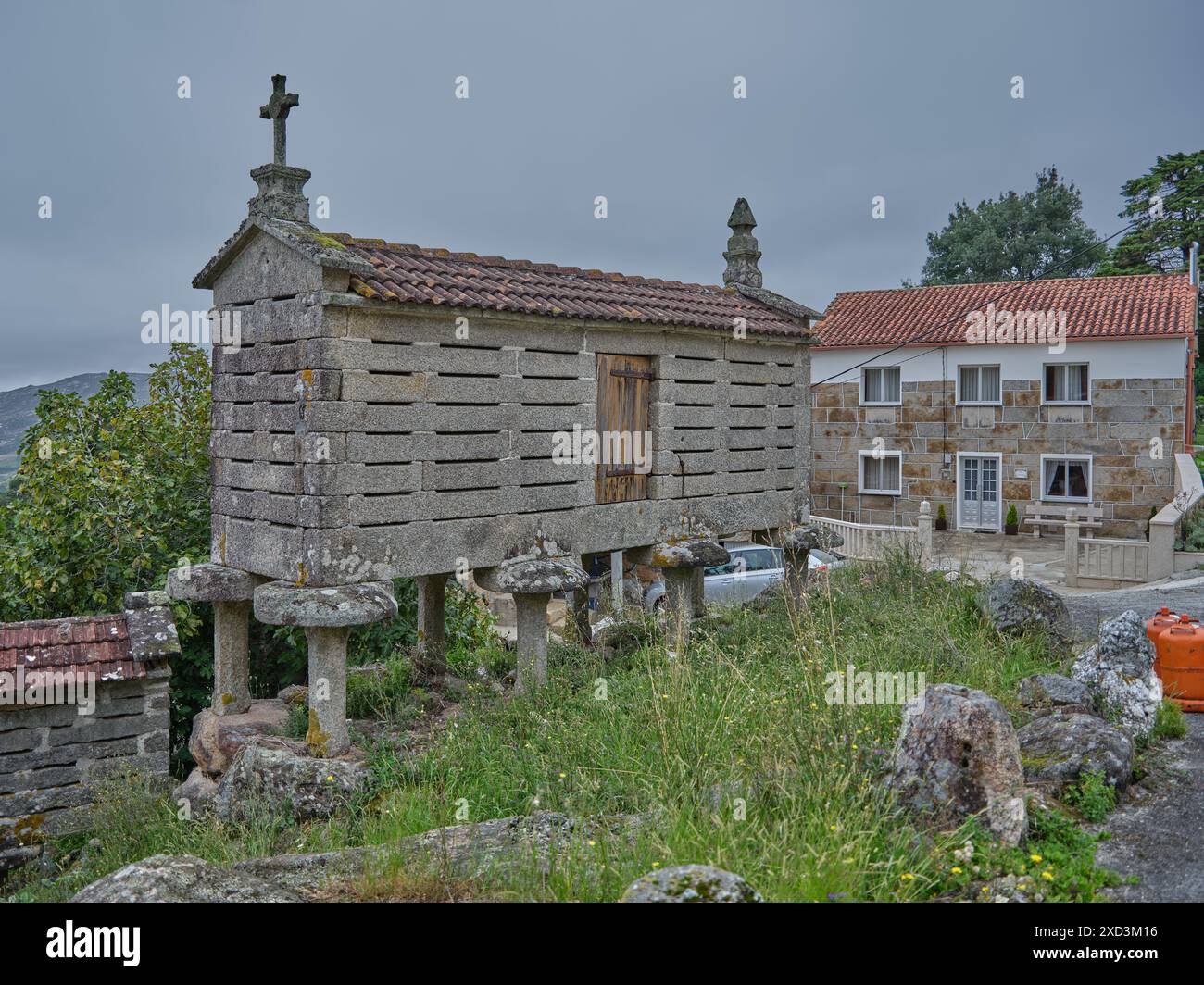 horreos, a ventilated wood or stone construction with feet where crops ...