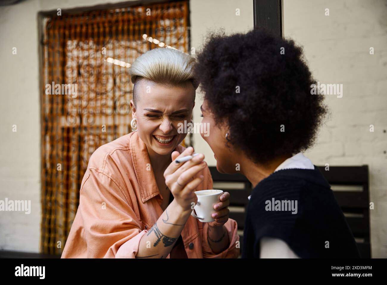 Beautiful diverse couple of women standing close in a romantic moment ...