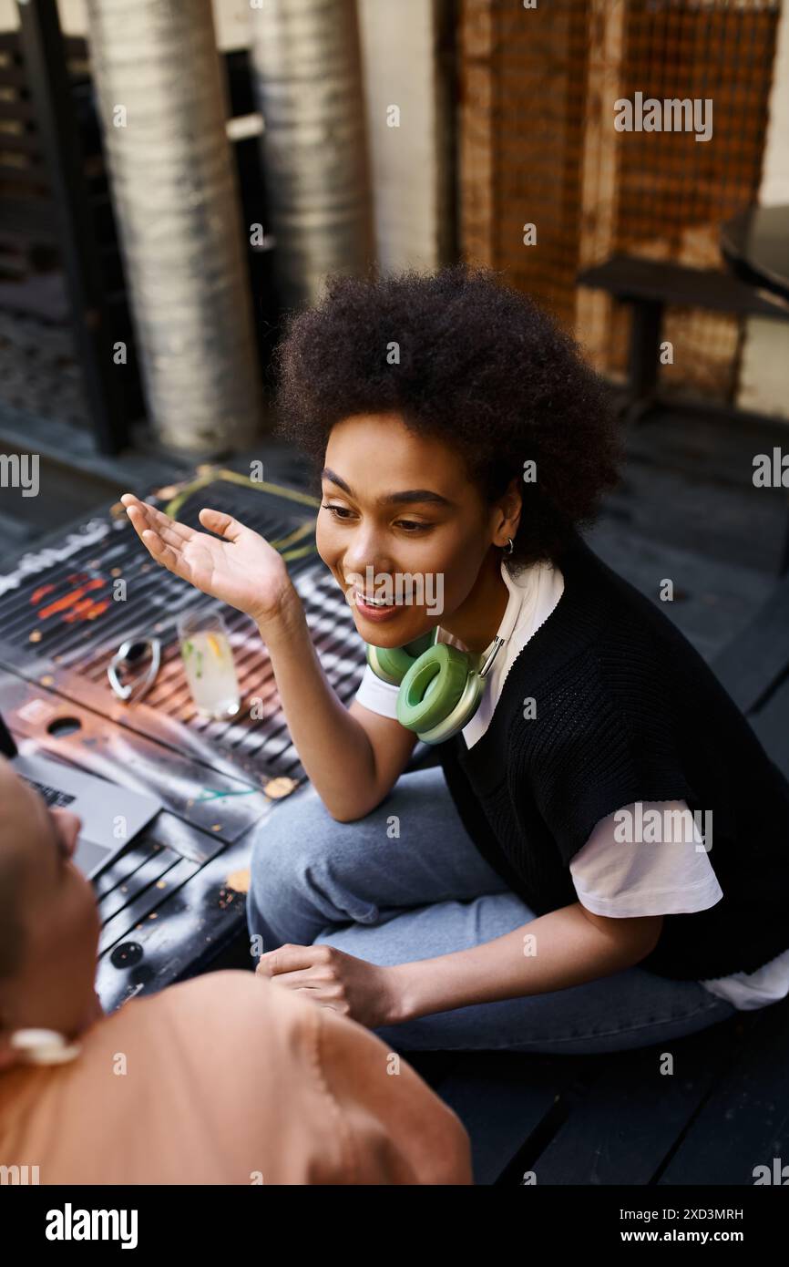 Two women engaged in conversation Stock Photo - Alamy