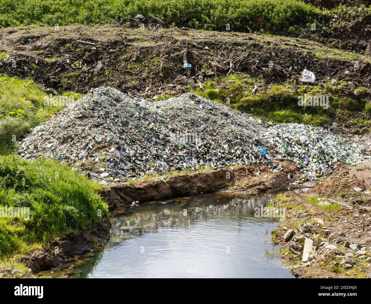 Glass bottles that arent recycled, dumped in an old quarry on the Isle ...