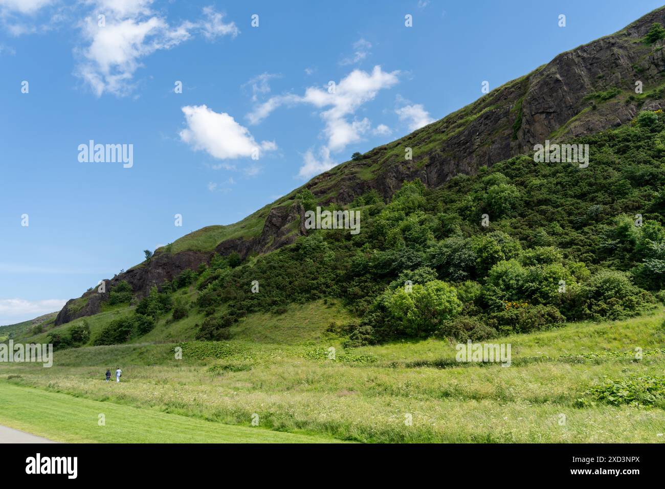 Edinburgh, Scotland, UK. Two people walking in Holyrood Park, at the ...