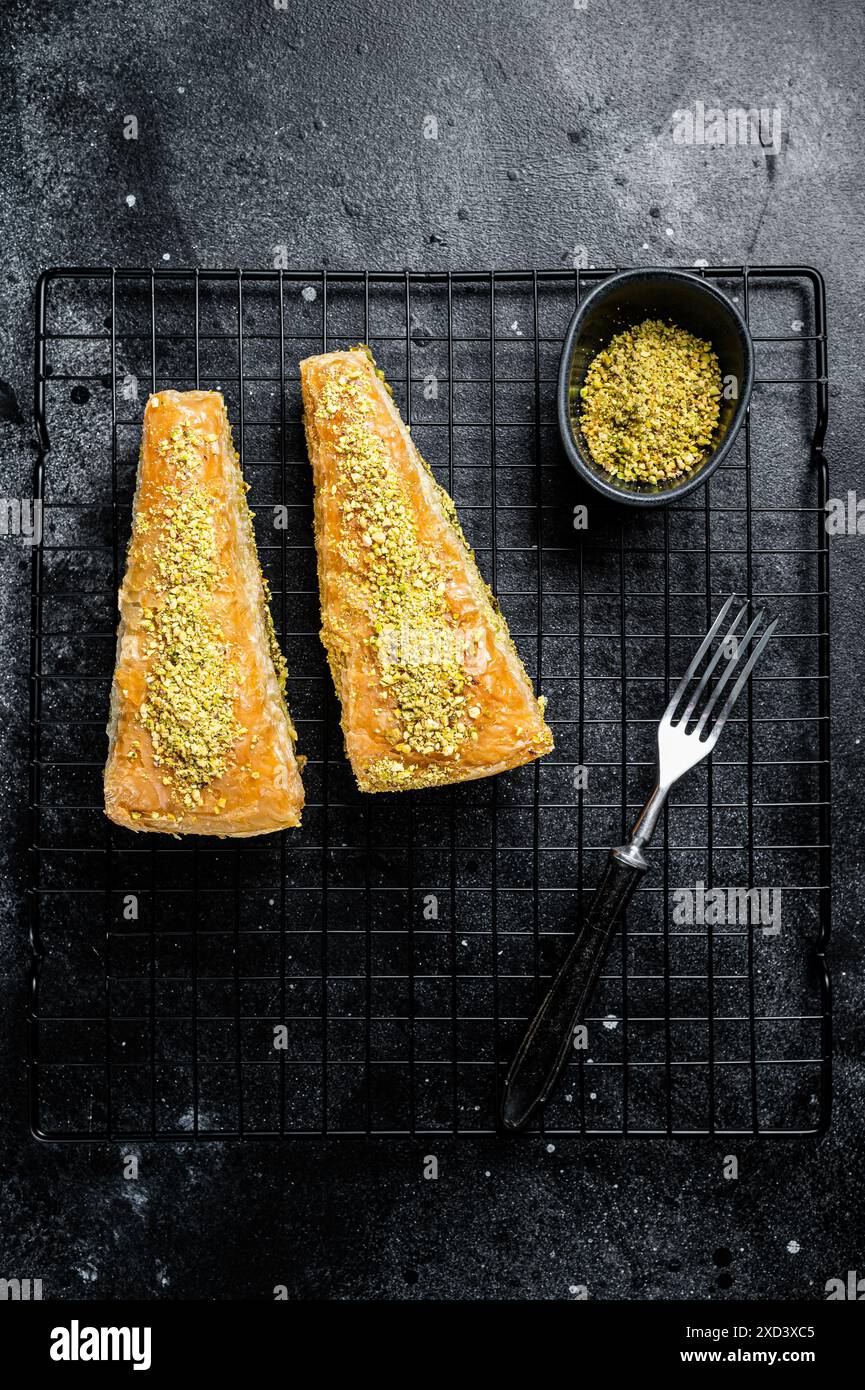 Turkish delights Havuc Dilim Baklava with pistachio and honey. Black ...