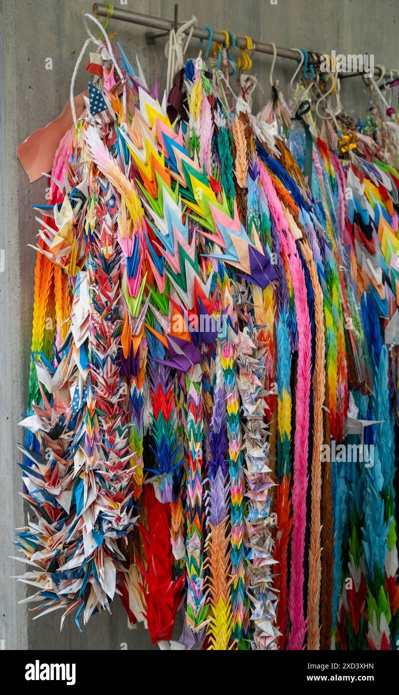 Origami Cranes made by schoolchildren at the base of the Memorial Tower ...