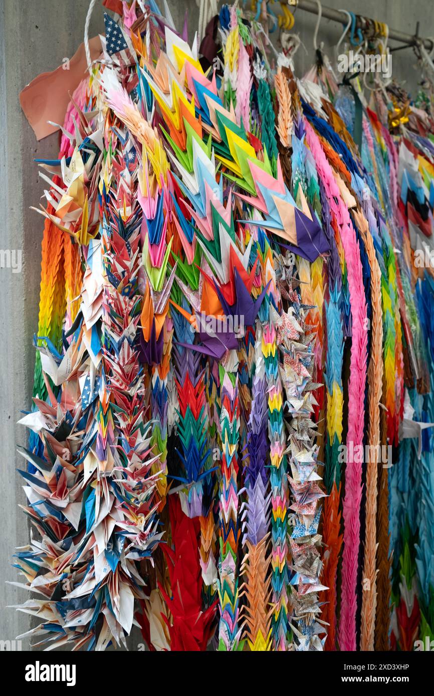 Origami Cranes made by schoolchildren at the base of the Memorial Tower ...