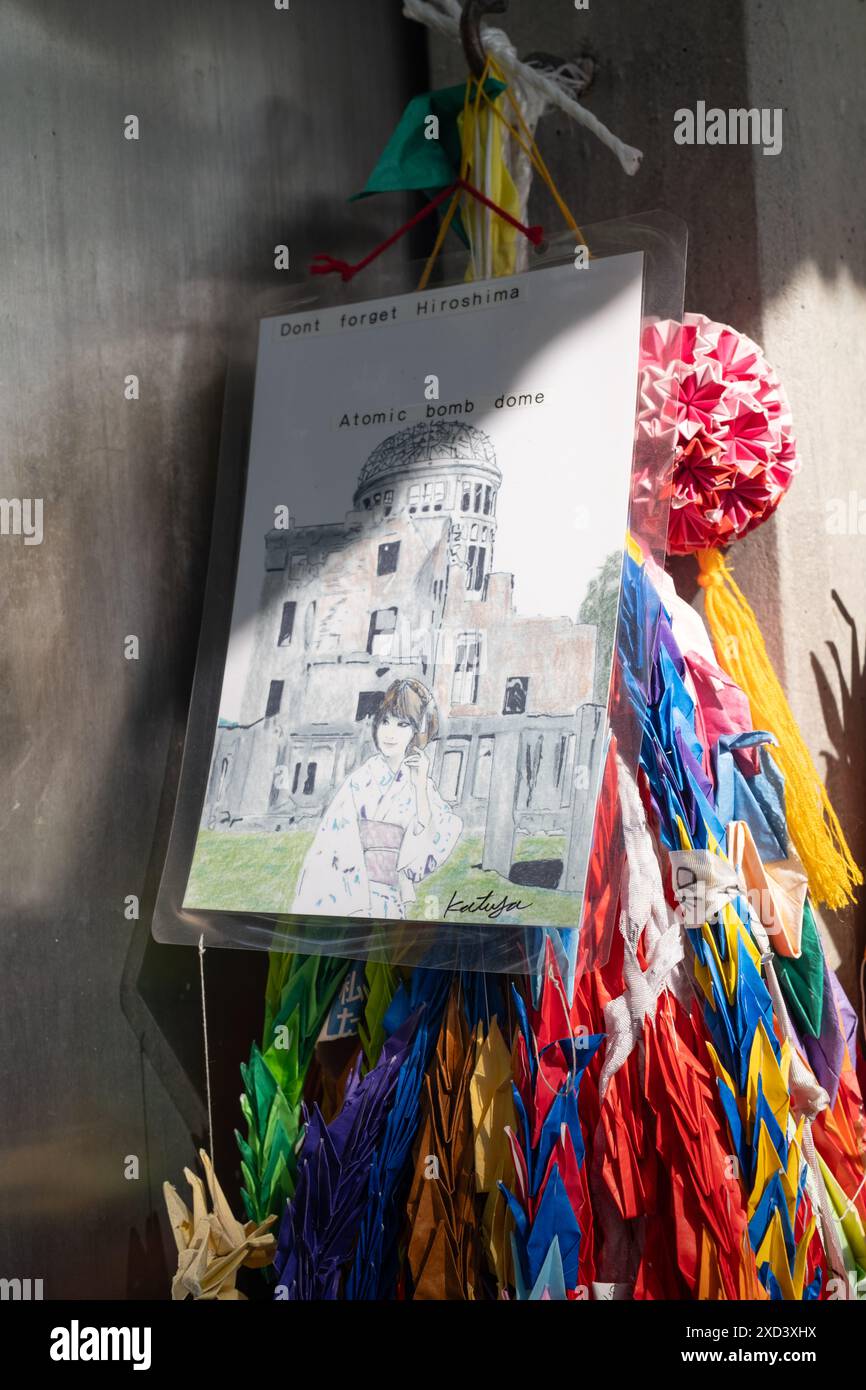 Origami Cranes made by schoolchildren at the base of the Memorial Tower ...