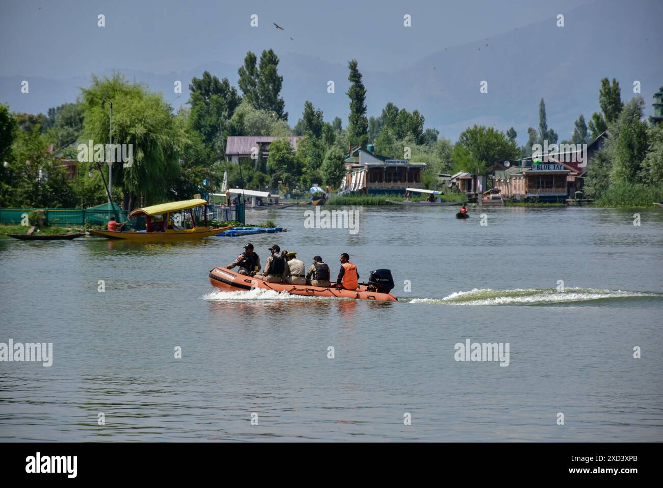Government forces patrol in a boat across the Dal lake near the Sher-I ...