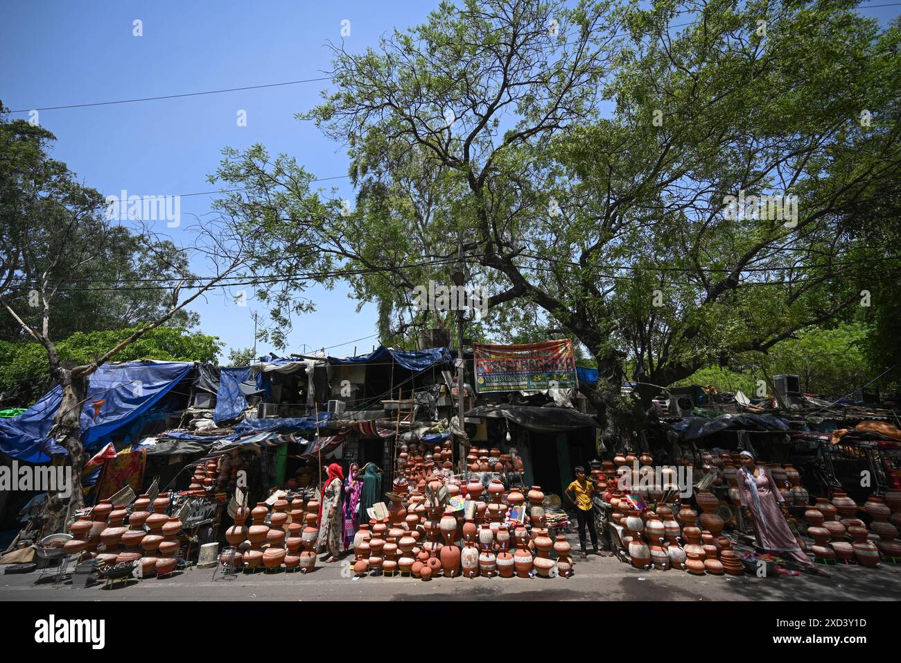 NEW DELHI, INDIA - JUNE 17: Earthen pots for water seen getting sold ...