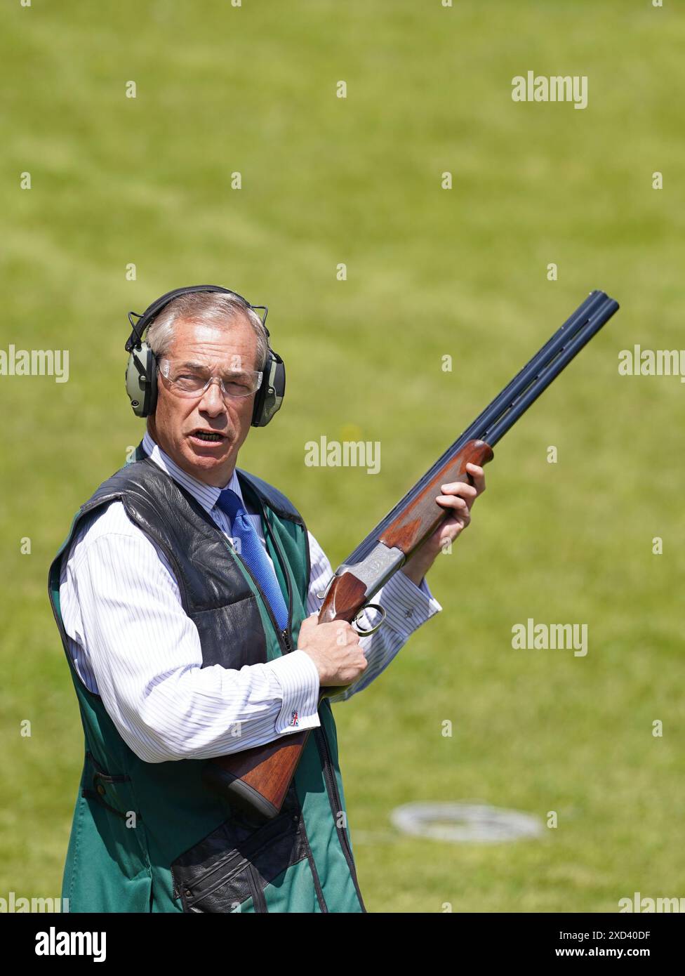 Reform UK leader Nigel Farage takes part in clay pigeon shooting during ...