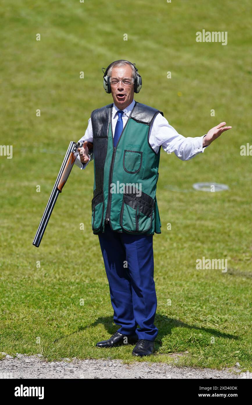 Reform UK leader Nigel Farage takes part in clay pigeon shooting during ...