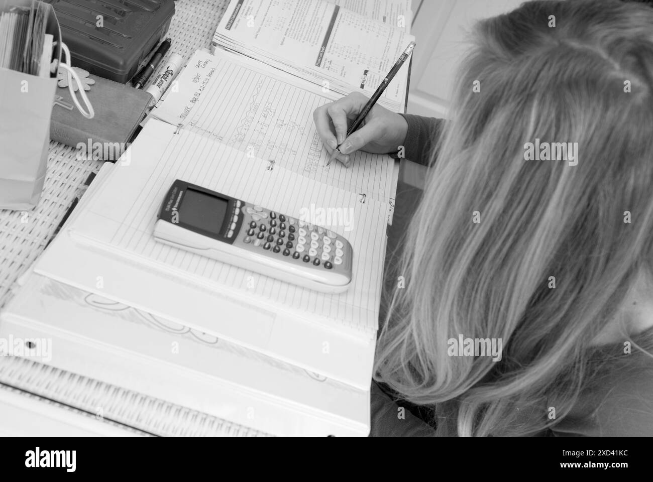Girl doing schoolwork Black and White Stock Photos & Images - Alamy