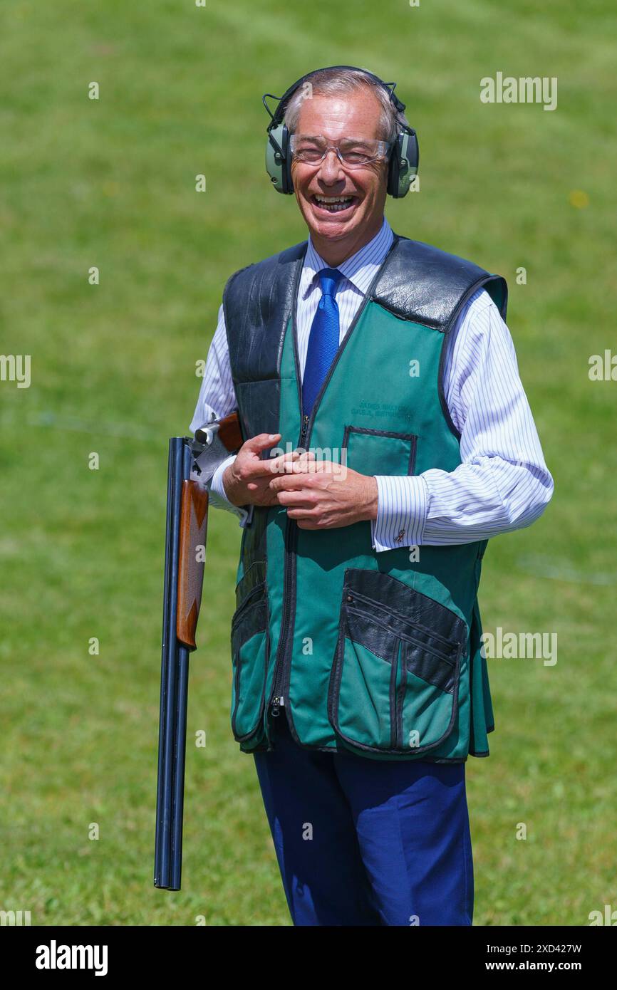 Reform UK leader Nigel Farage takes part in clay pigeon shooting during ...