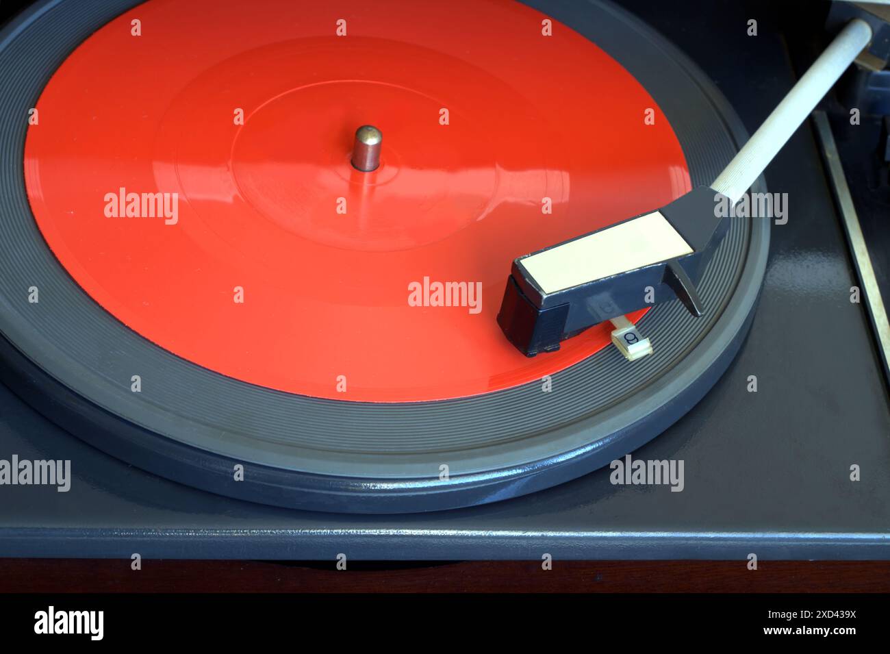 Old vintage record player with 7 inch flexible record on the disk top ...