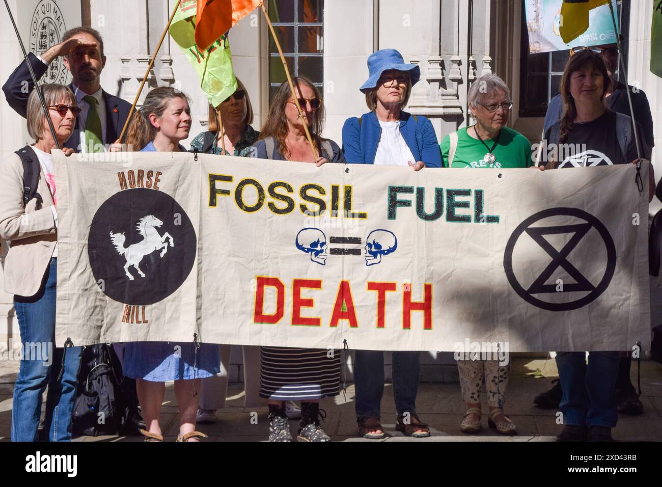 London, UK. 20th June 2024. Environmental activists gather outside the ...