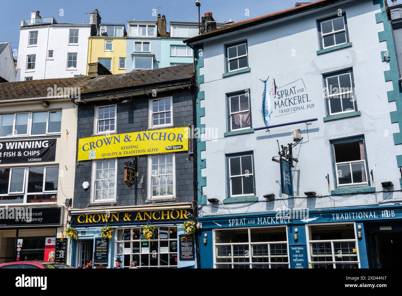 Pubs on The Quay, Brixham, Devon Stock Photo - Alamy