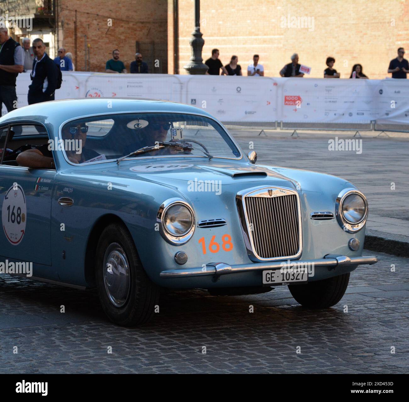 FERRARA , ITALY - jun 15 -2024 : A classic car races through the ...