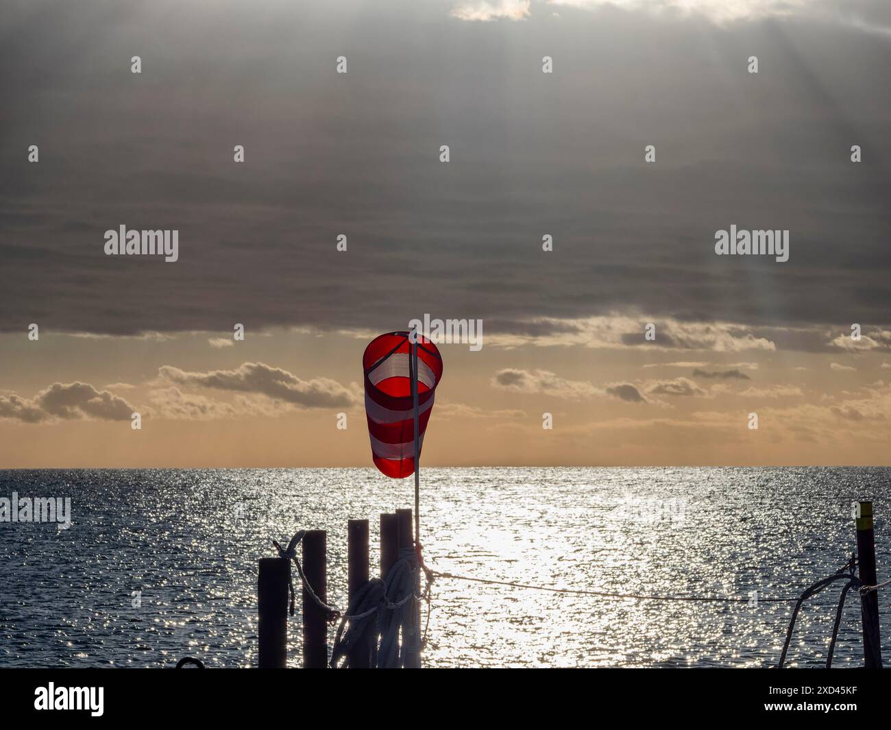 Windsock at sunrise over the sea in the Strait of Magellan, Punta ...
