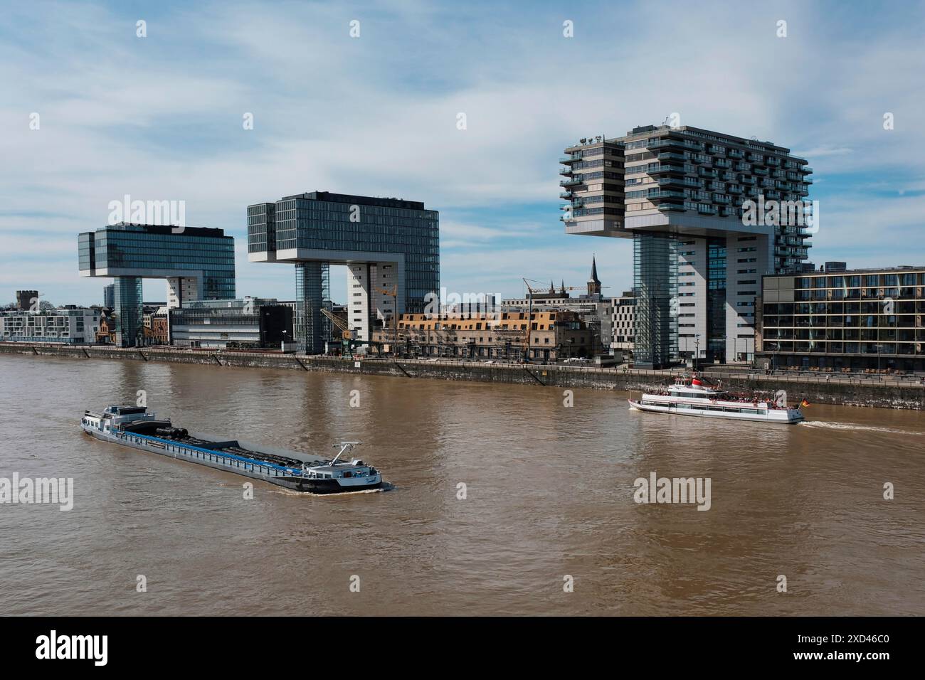 View of the Cologne crane houses, in front of a cargo ship, Cologne ...