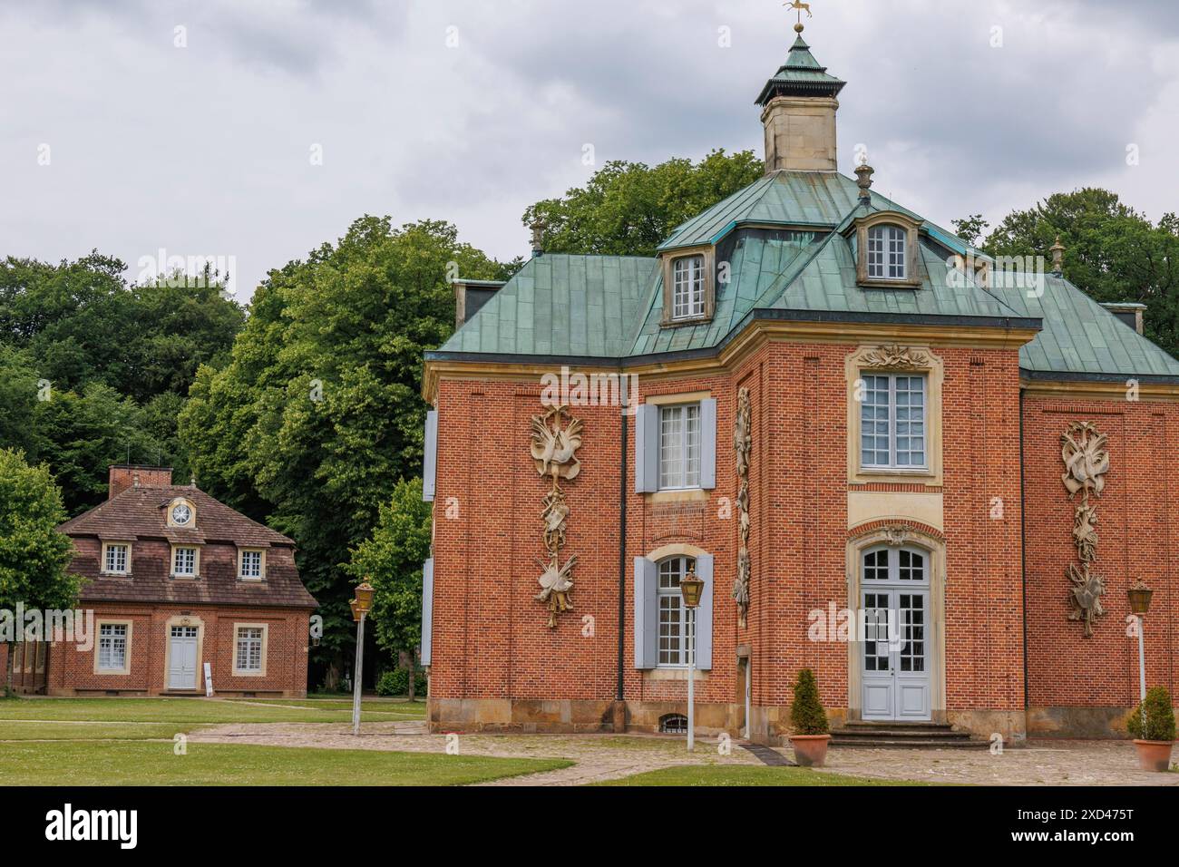 Large brick building with green roofs and ornate windows, Soegel ...