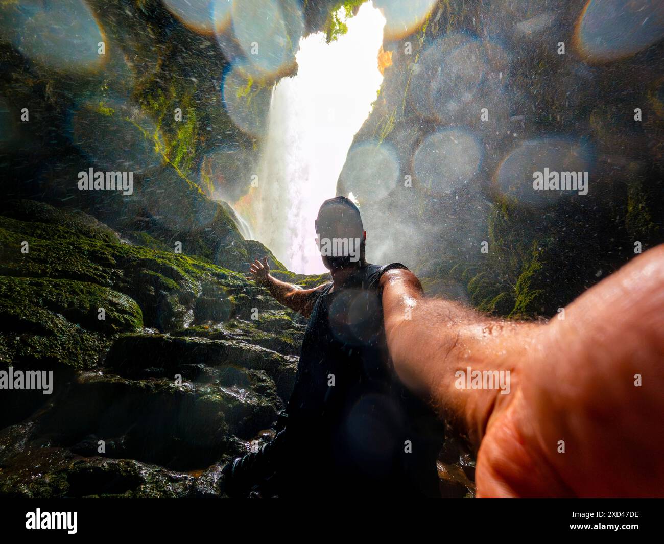 Selfie of a tourist inside the Iris grotto at the Cola de Caballo ...