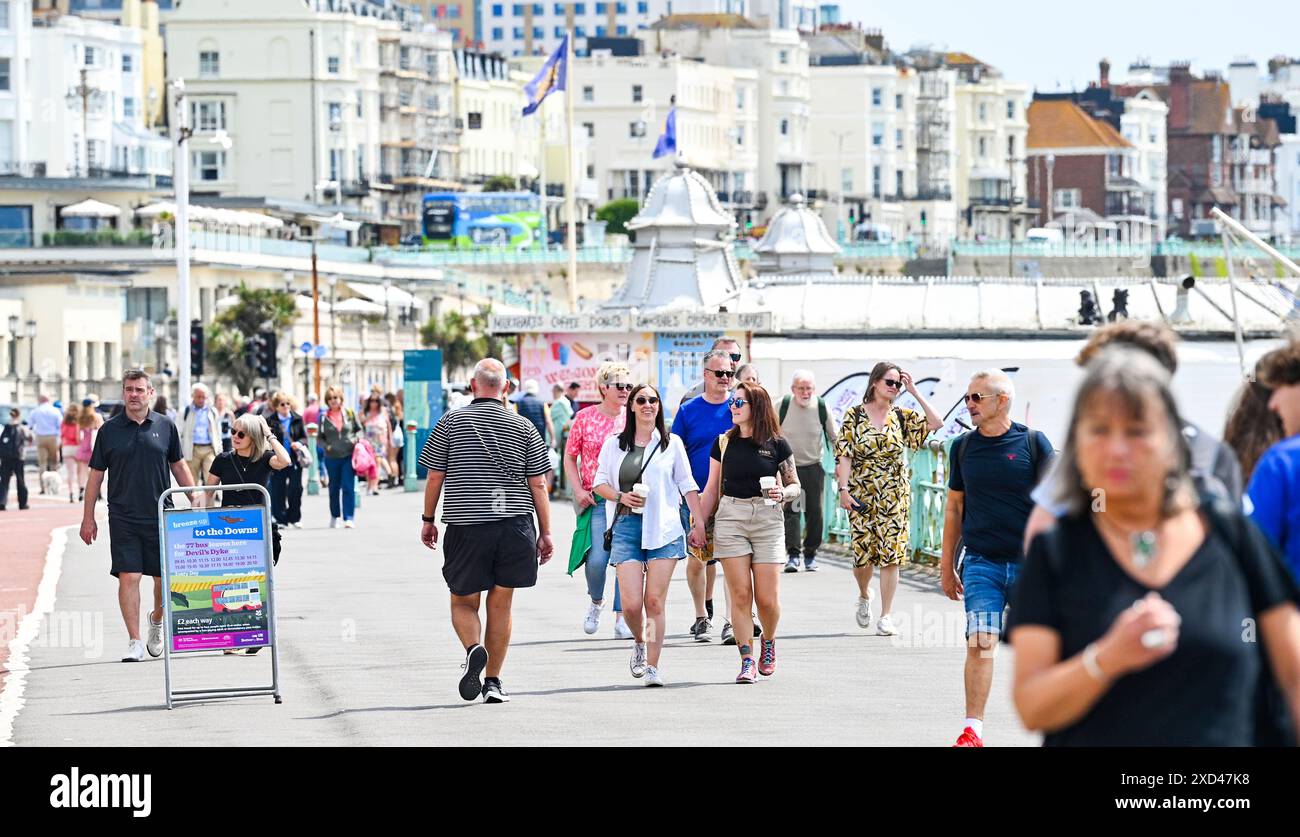 Brighton UK 20th June 2024 - Visitors enjoy the sunshine on Brighton ...