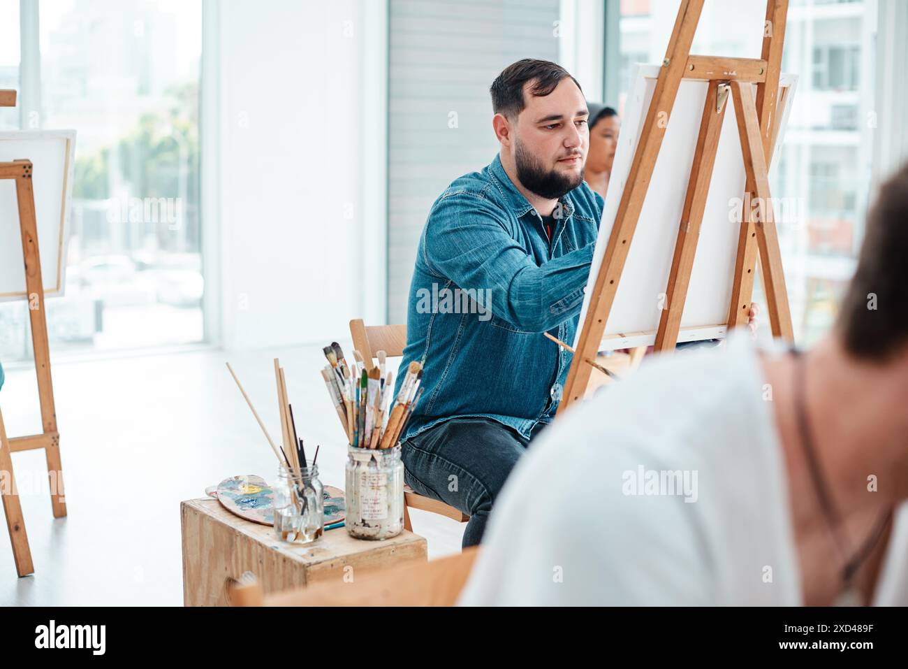 Man, artist and creativity with painting in art class as talent or ...