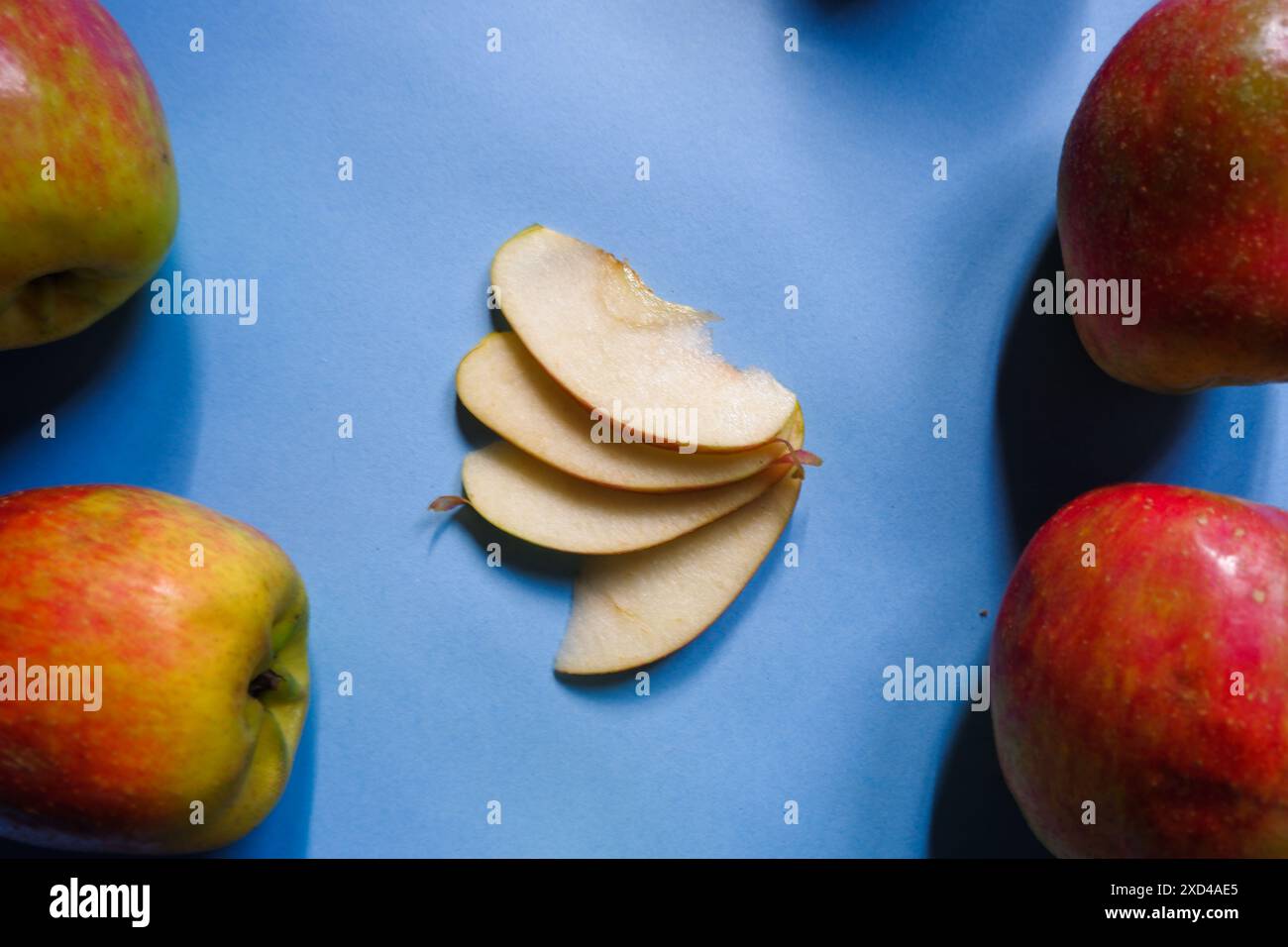 A split apple with a blue background, a perfect photo for a food ...