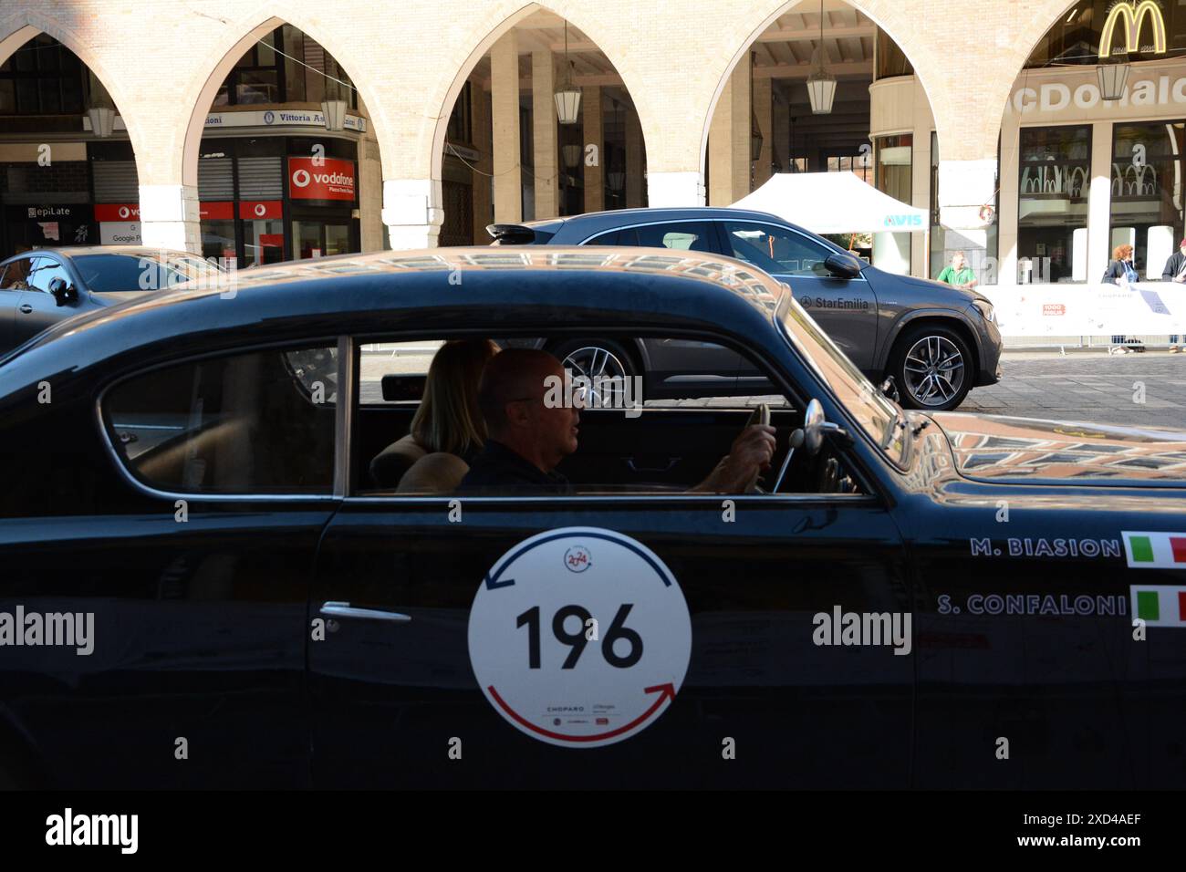 FERRARA , ITALY - jun 15 -2024 : A classic car races through the ...