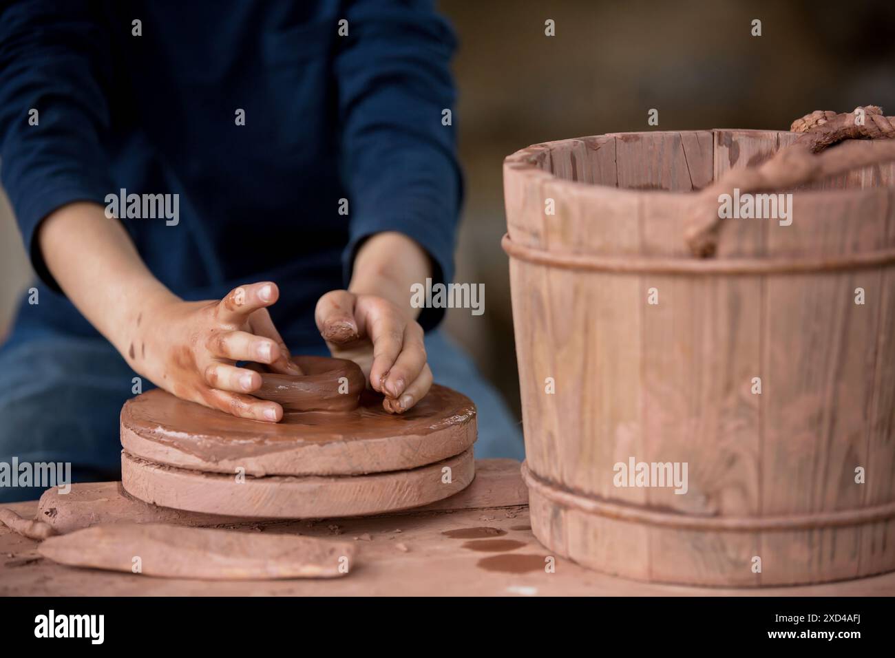 Child, cute boy, making ceramic pot on a farm Stock Photo - Alamy